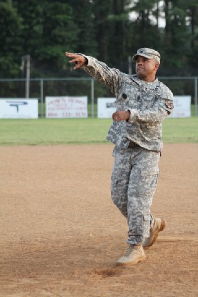 Command Sgt. Maj. Miguel E. Reyna delivers the first pitch | Article ...
