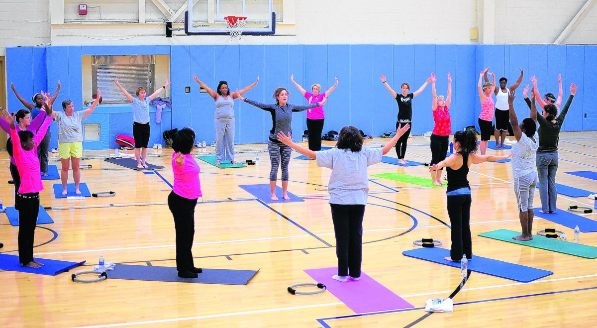 Fitness center opens new Yogalates class - Aerobics program expands ...