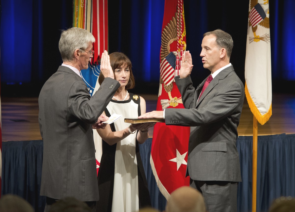 Secretary of the Army administers the oath of office to the 40th ...