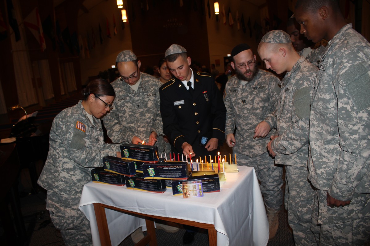Community welcomes new rabbi to installation, celebrates Chanukah ...