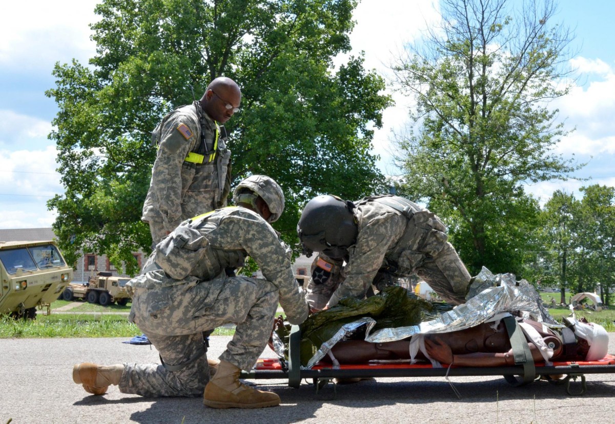 A flight medic evaluates a simulated patient for transport. | Article ...