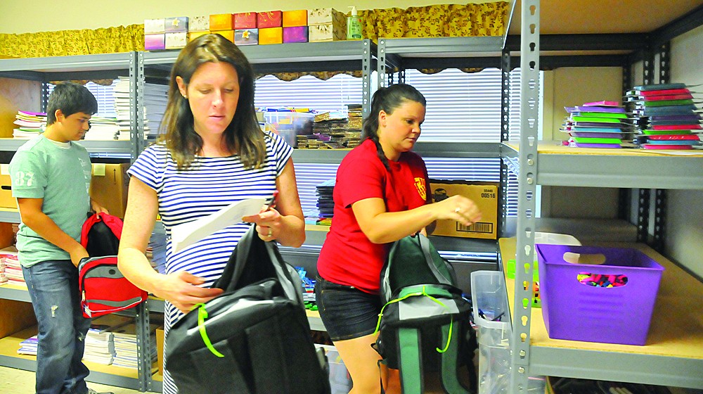 Back-to-School Brigade: Operation Homefront volunteers fill backpacks ...