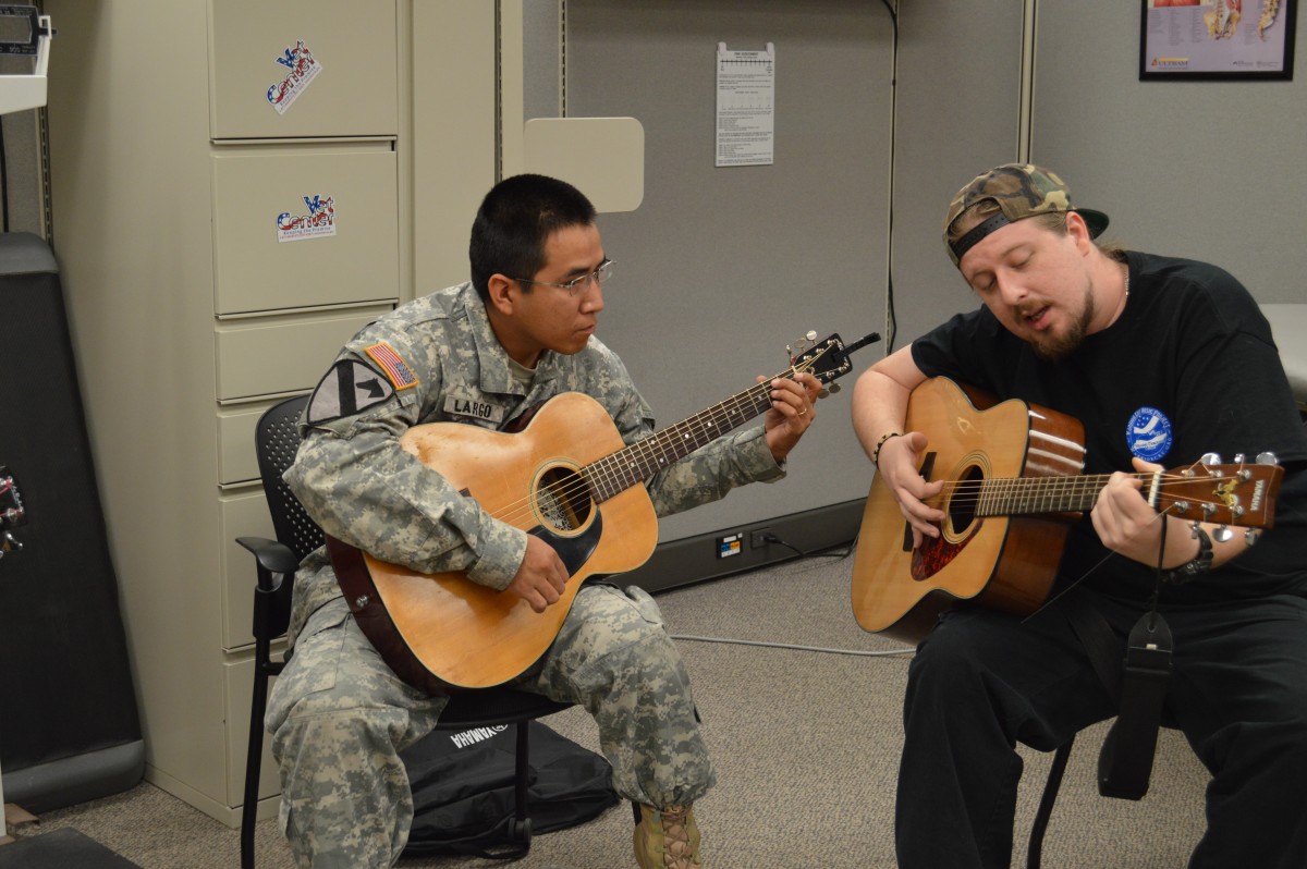 Wounded Soldiers learn to play musical instruments as part of their ...