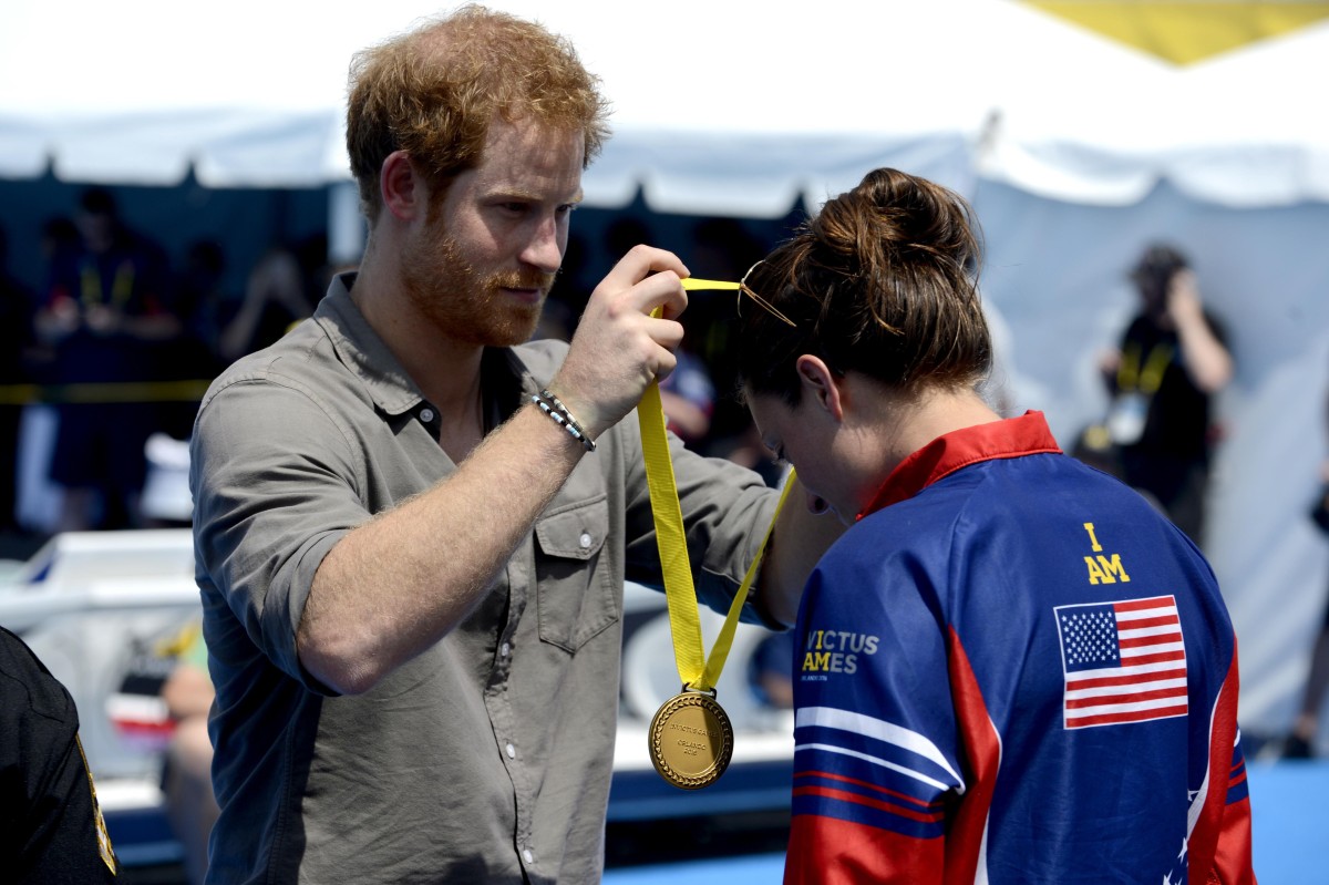 Swimmer asks Prince Harry to give gold medal to hospital that saved her ...