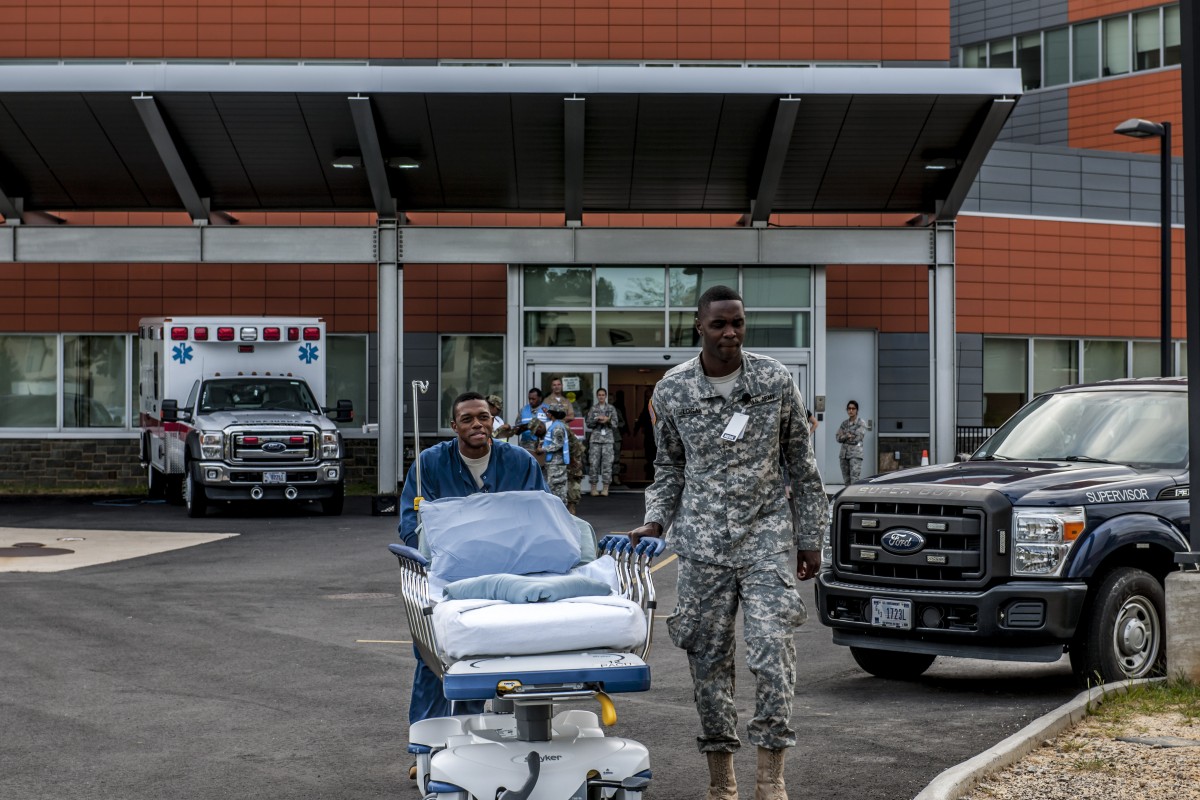 Hospital, emergency personnel drill for active shooter, mass casualty ...