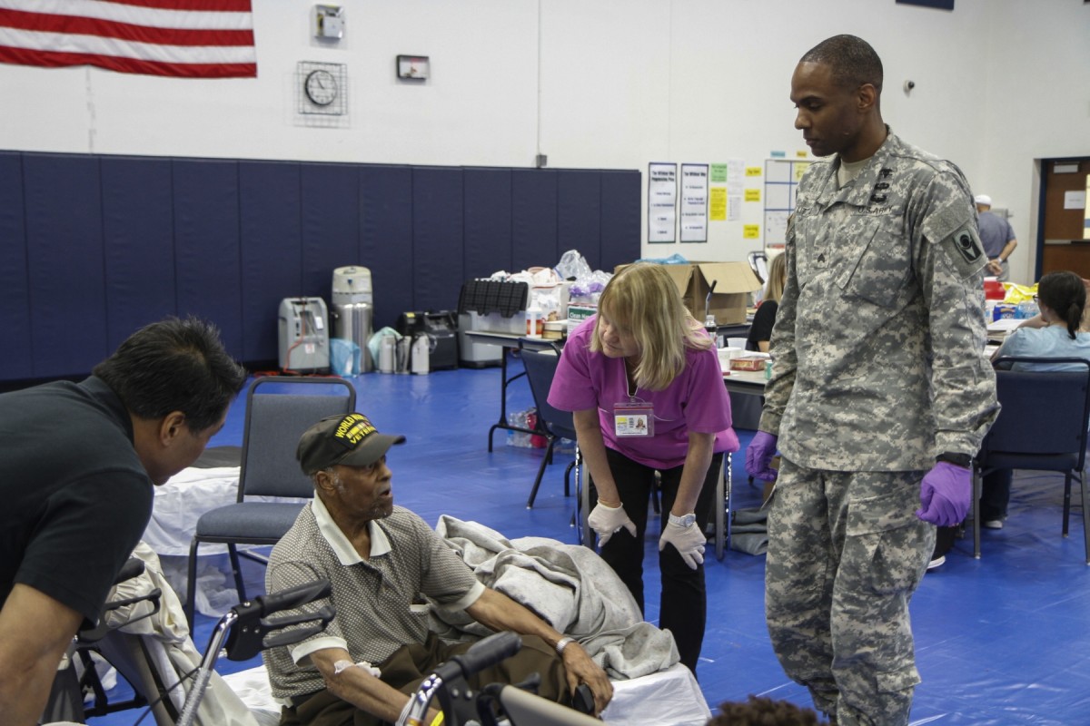 Citizens and Soldiers Come Together as a Community after the Storm ...