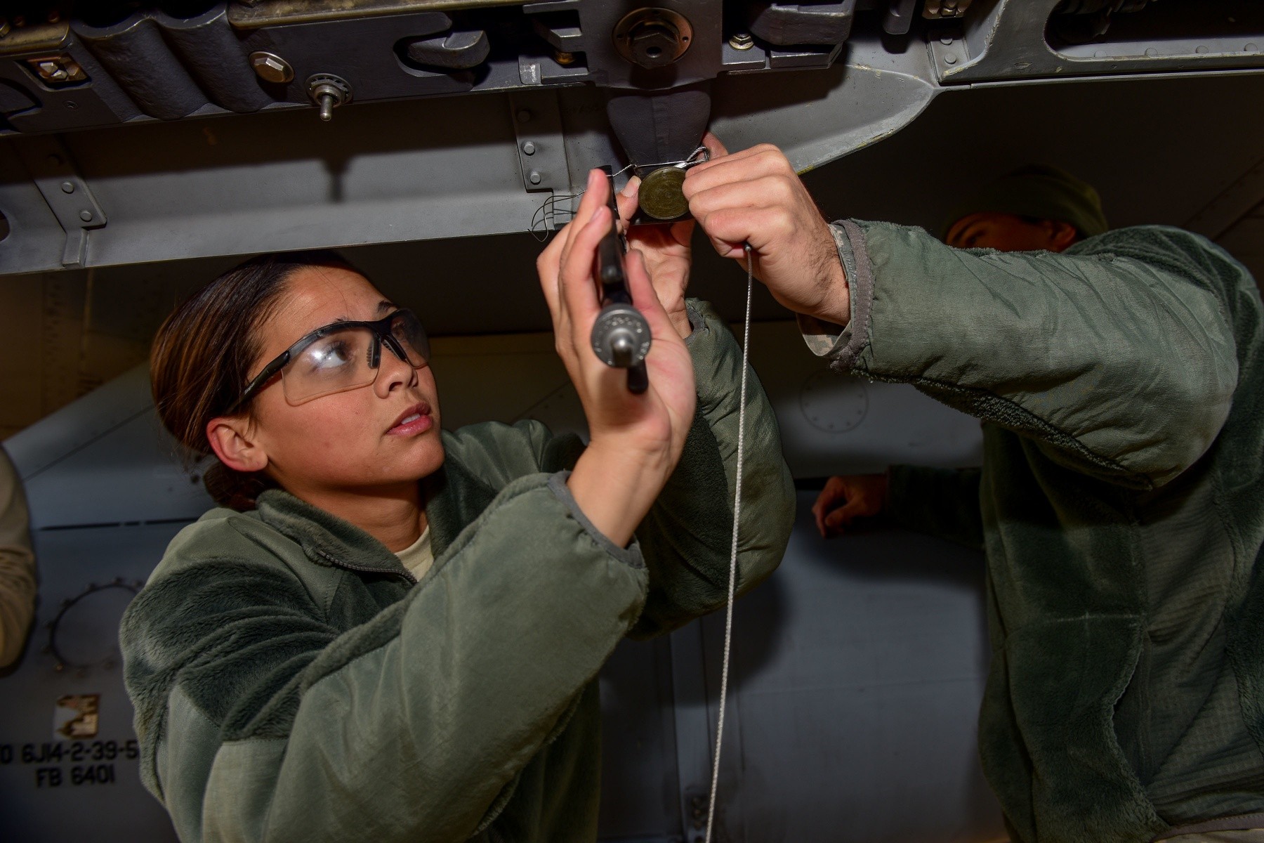 Females on the flight line: breaking barriers and loading weapons ...