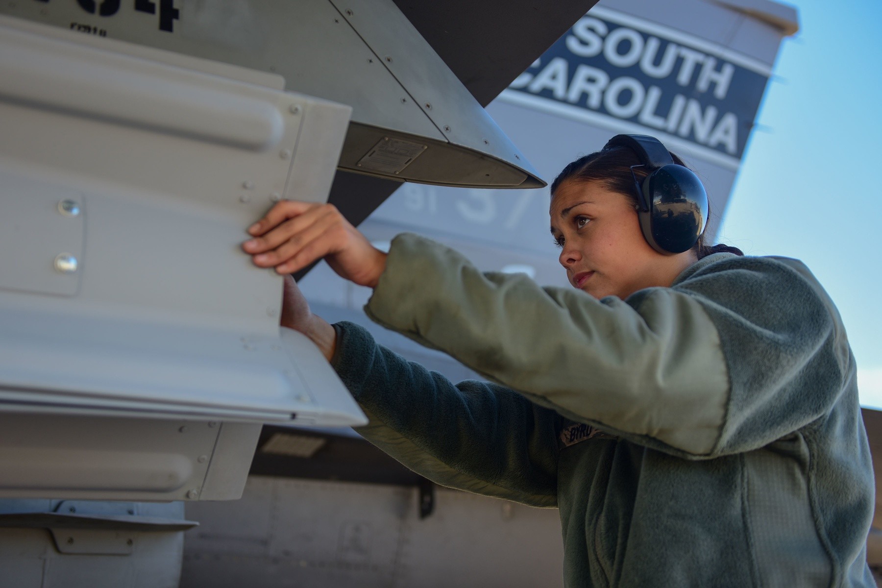 Females on the flight line: breaking barriers and loading weapons ...
