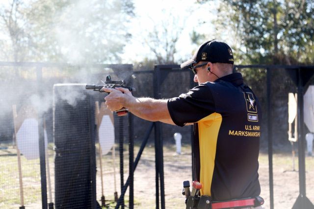 Soldiers compete in action shooting, hit targets in course with ...