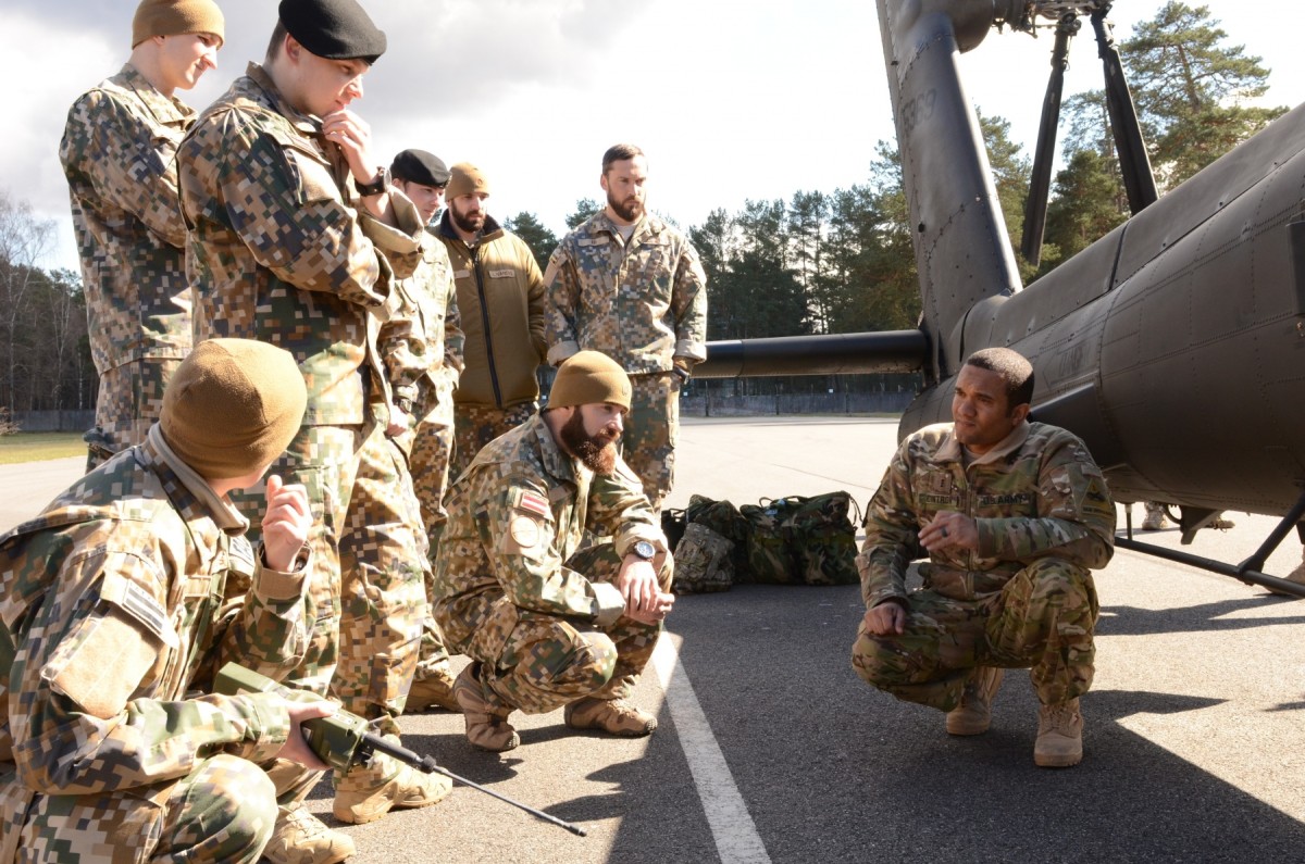 Task Force Falcon Soldiers brief Apache capabilities during Operation ...