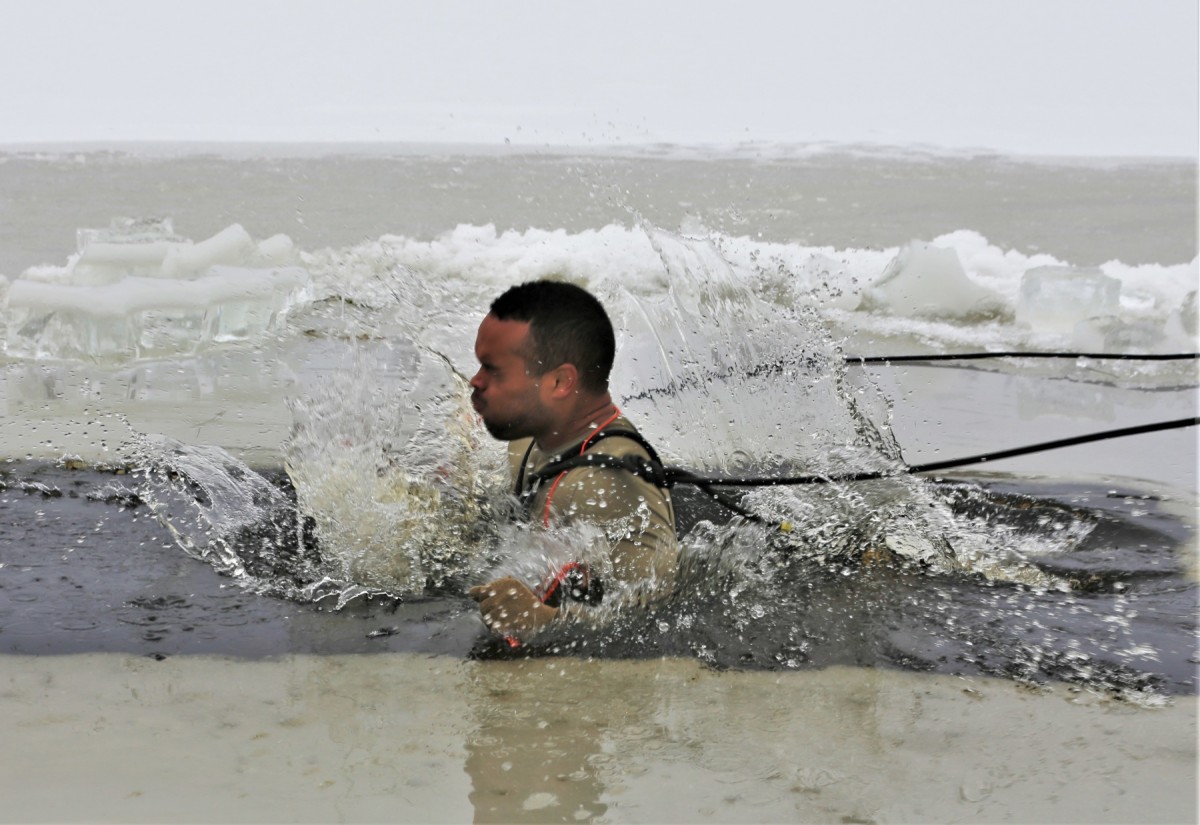 Students take icy plunge for cold-weather operations training at Fort ...