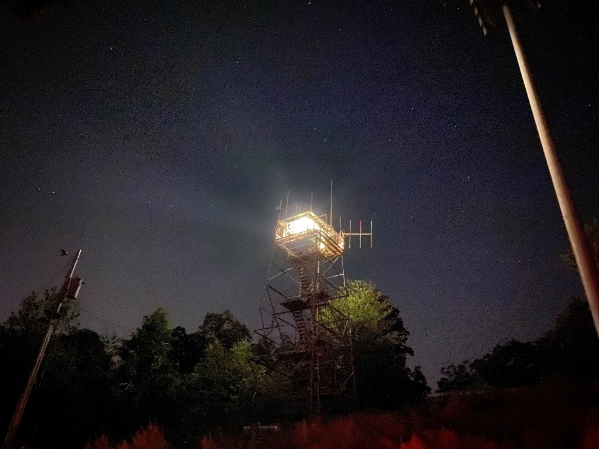 Historic fire lookout tower lights up for first time in nearly 30 years ...
