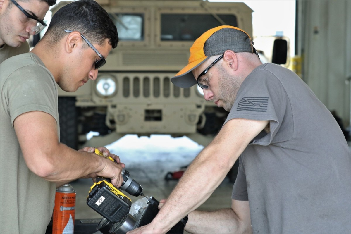 Mechanics with military police units turn wrenches during Operation ...