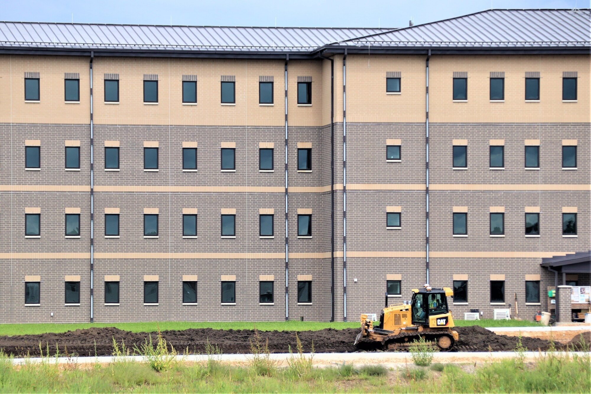 Final exterior grading takes place at fiscal year 2020-funded barracks ...