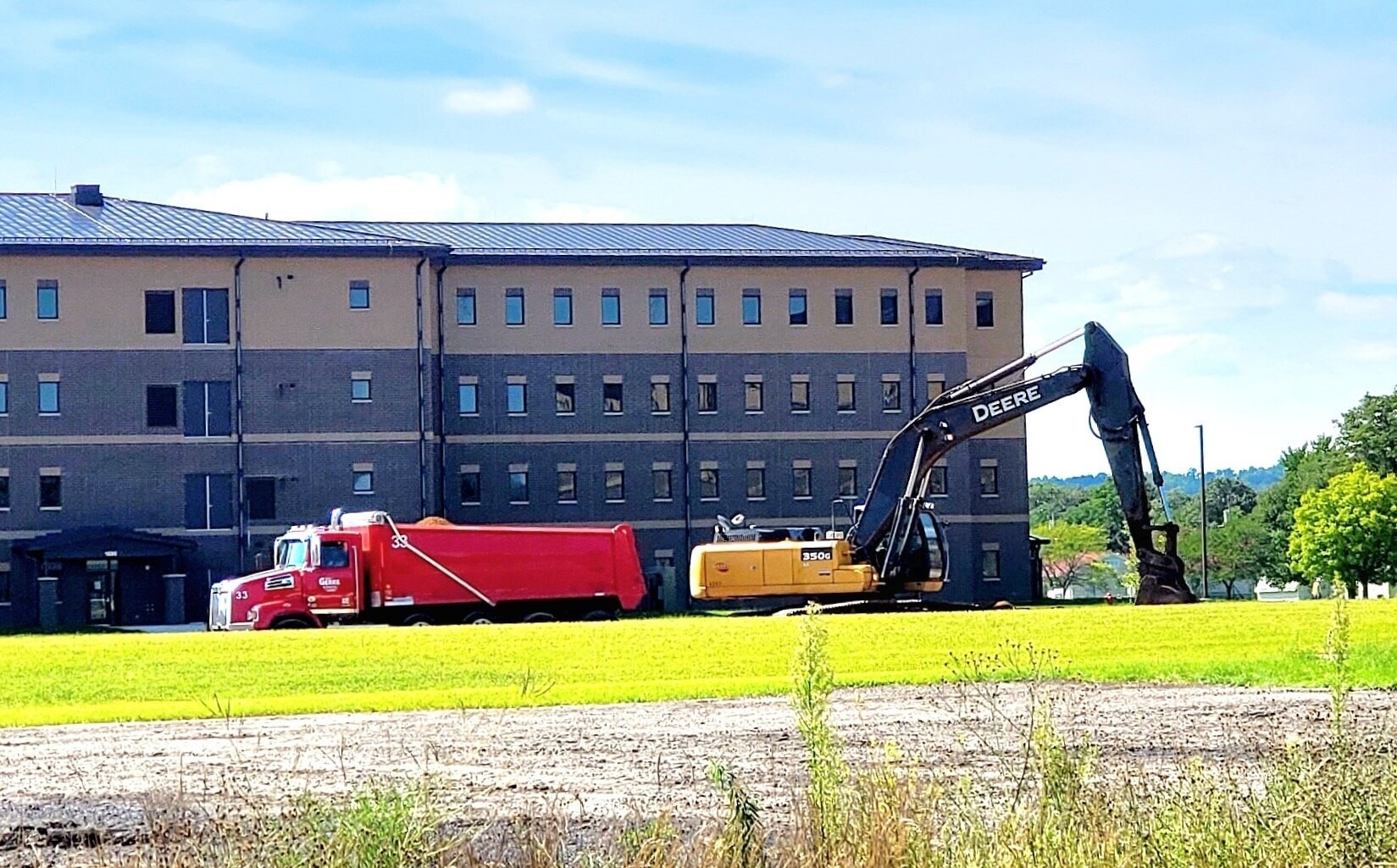 Final exterior grading takes place at fiscal year 2020-funded barracks ...