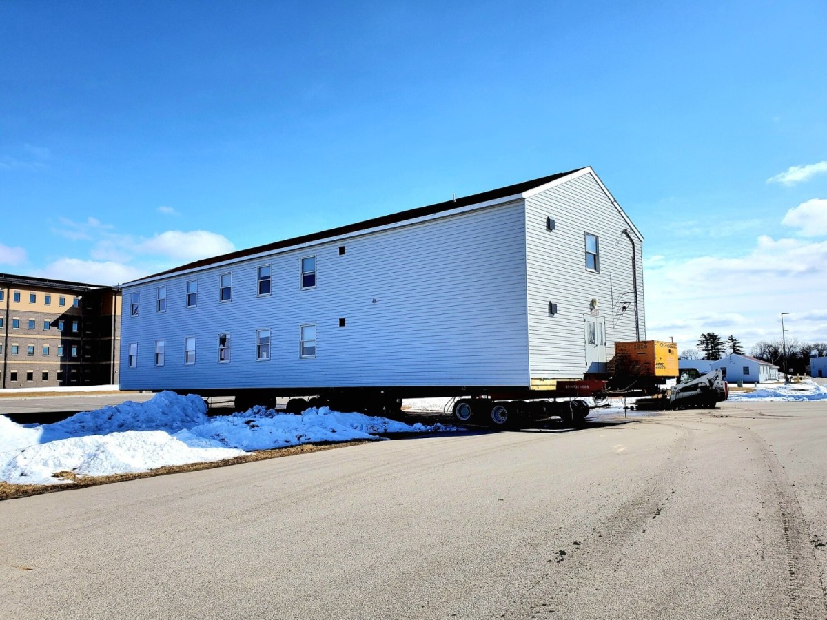 Photo Essay: Contractors move second World War II-era barracks building ...