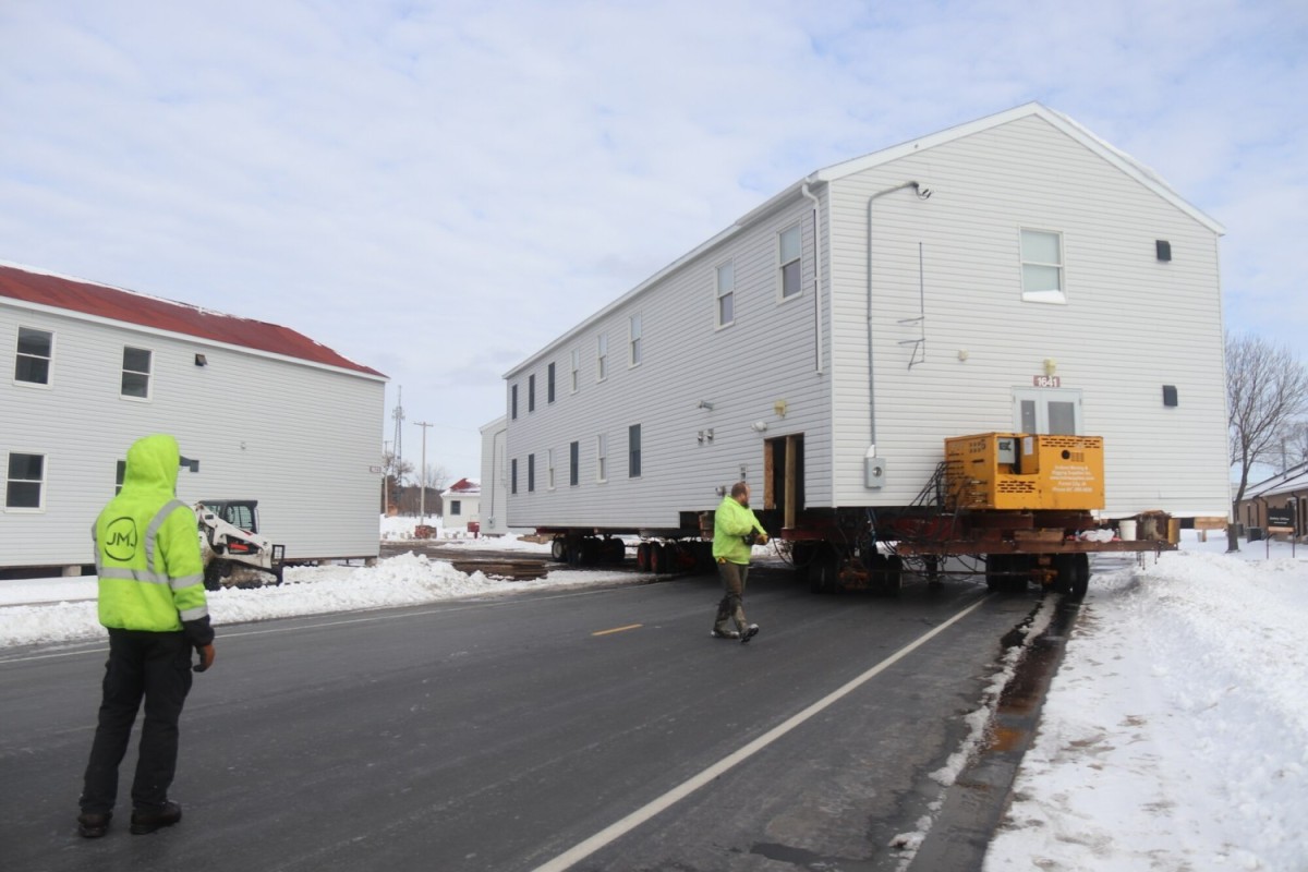 Photo Essay: Contractors move World War II-era barracks building at ...