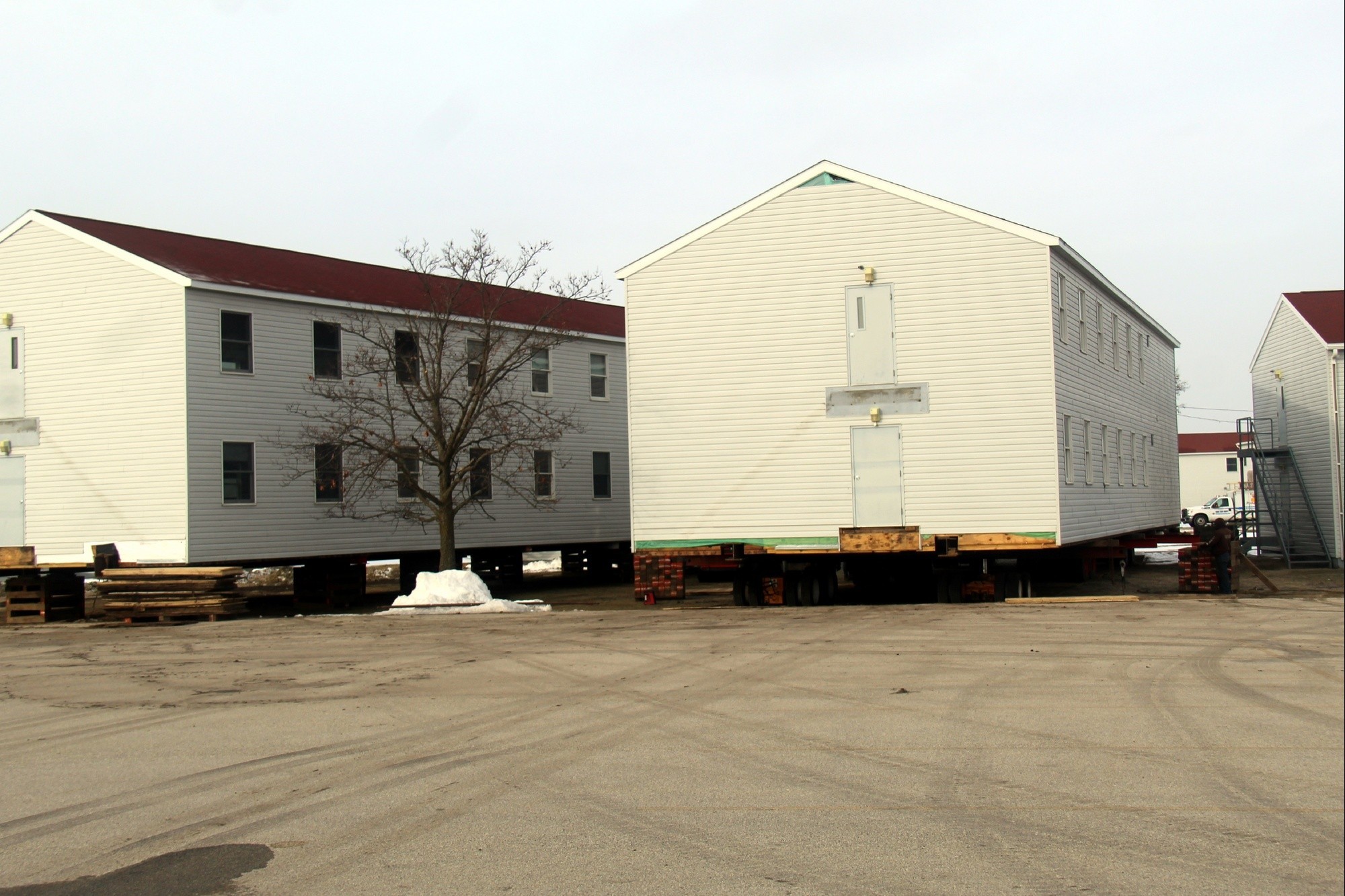 Photo Essay: Contractor moves first two World War II-era barracks at ...