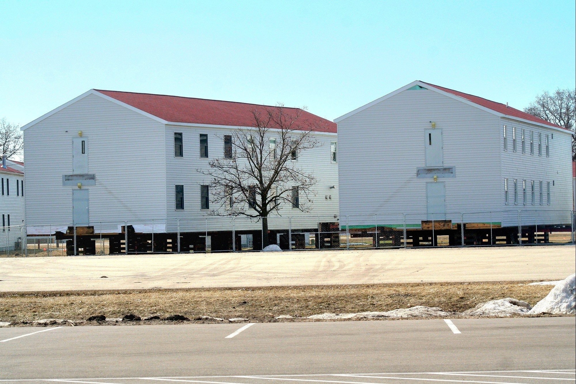 Photo Essay: Contractor moves first two World War II-era barracks at ...